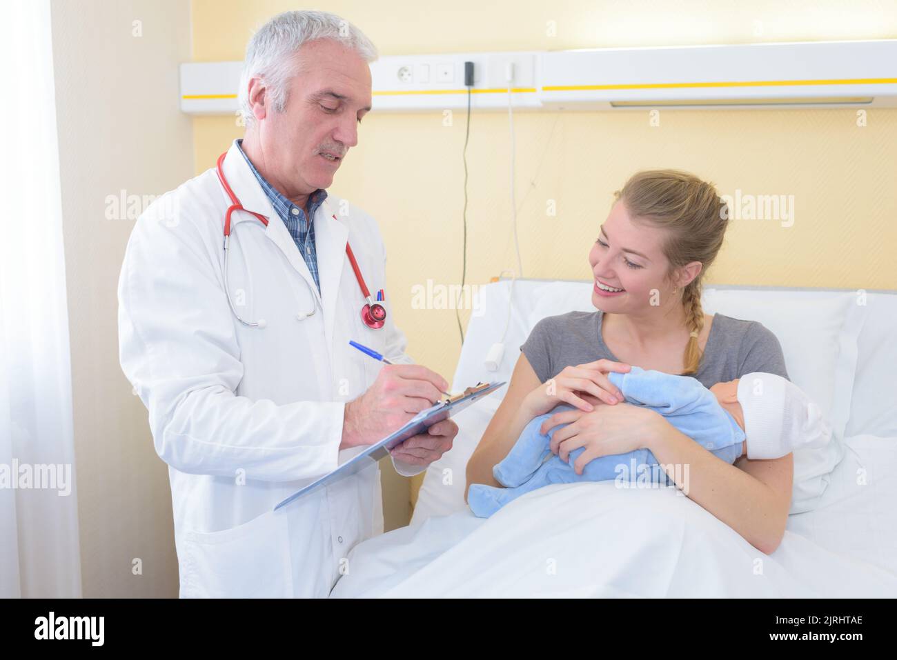 pediatric doctor visiting the newborn baby Stock Photo - Alamy