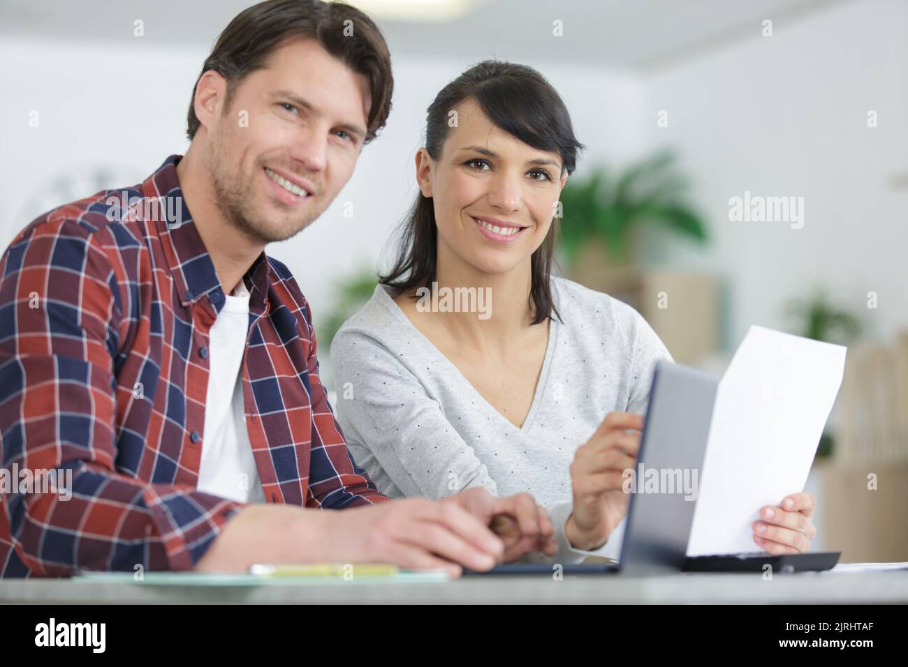 happy couple reading mail and checking accountancy Stock Photo - Alamy