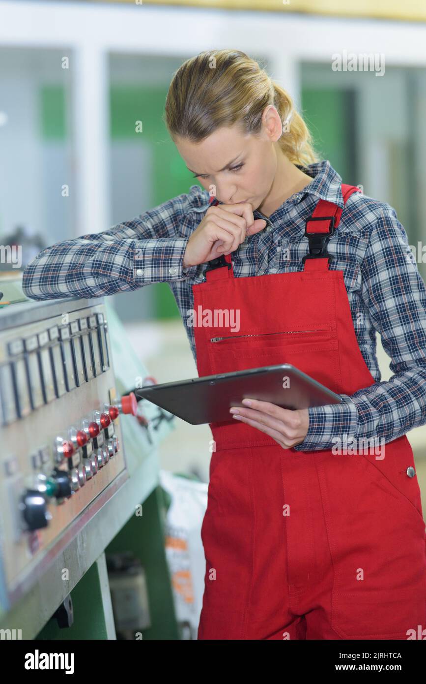 Female machine operator using digital hi-res stock photography and ...
