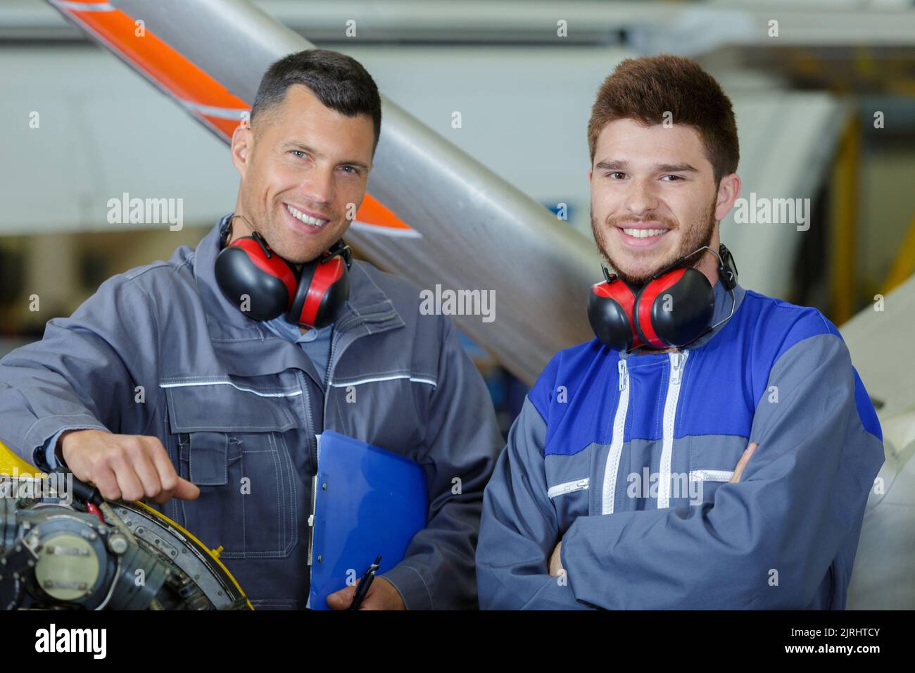 portrait of two flight mechanics Stock Photo - Alamy
