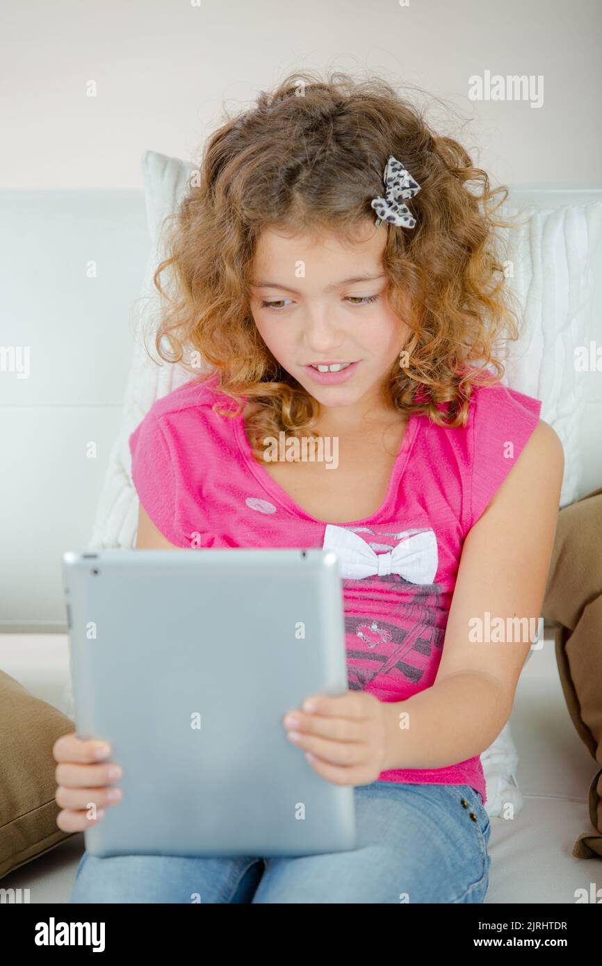 a child looking at tablet Stock Photo - Alamy