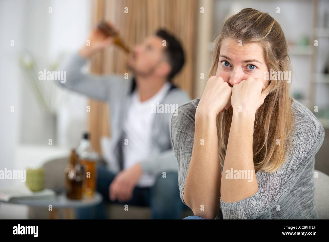drunk man suffering from alcoholism and wifestressed Stock Photo - Alamy
