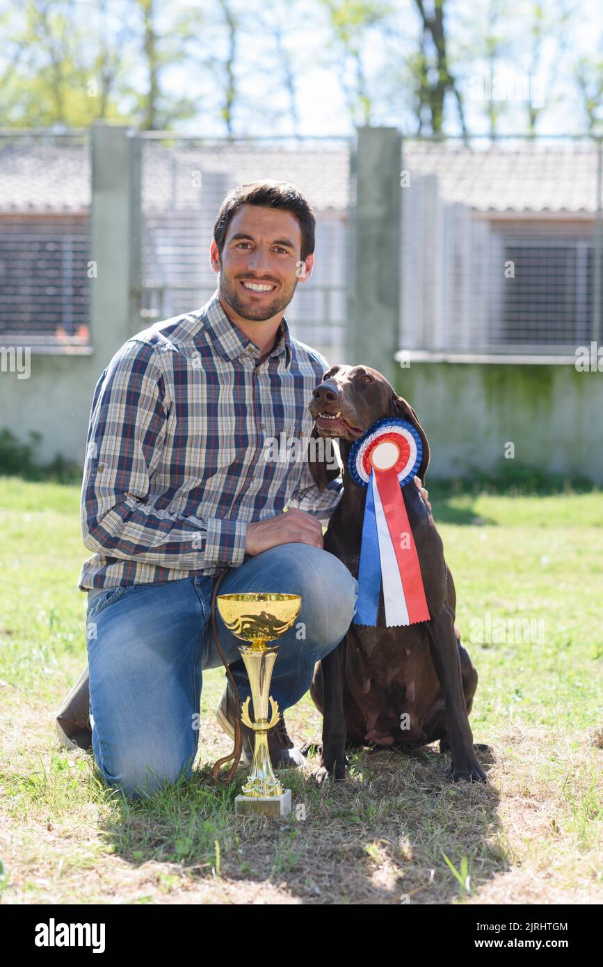 organizers of dog show against with winner dog Stock Photo - Alamy