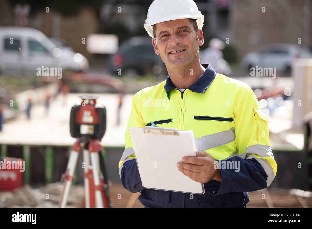 happy mature geometer at construction site Stock Photo - Alamy