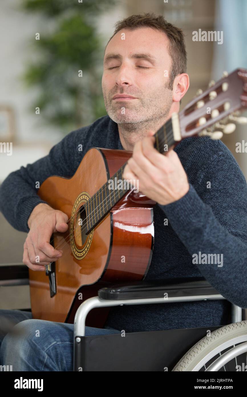 positive handicapped man proud of his hobby Stock Photo - Alamy