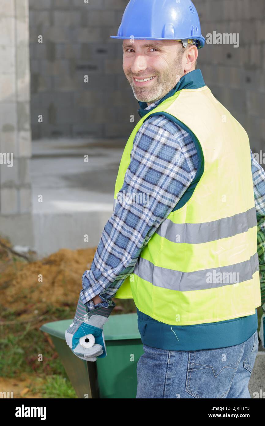 Using wheelbarrow in construction hi-res stock photography and images ...