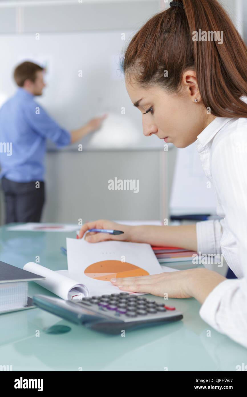 Woman calculating calculator taking notes hi-res stock photography and ...