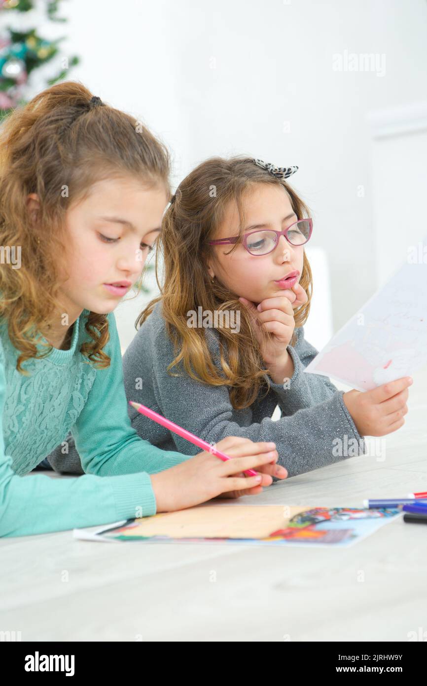Girls coloring crayons hi-res stock photography and images - Alamy