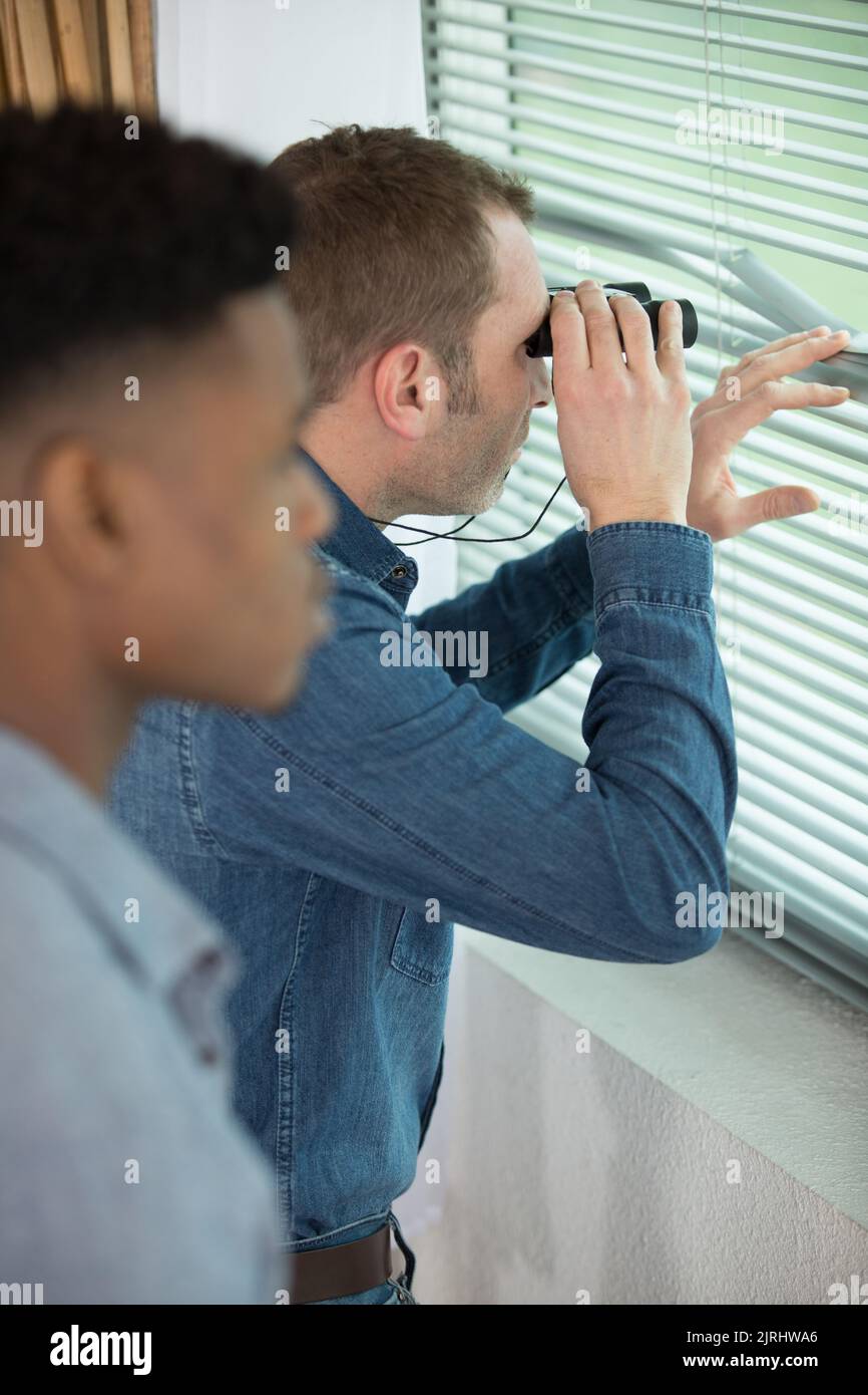 Binoculars looking through window hi-res stock photography and images ...