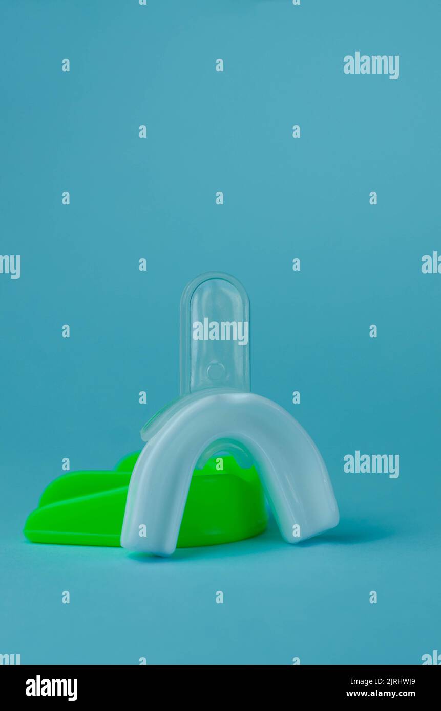 two rubber boxing mouth guards, white and green, protection for lips ...