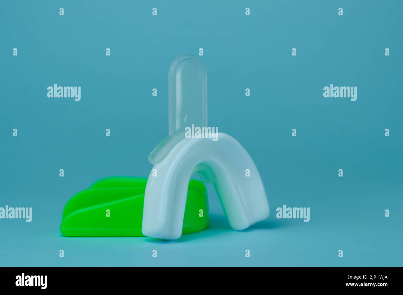 two rubber boxing mouth guards, white and green, protection for lips ...