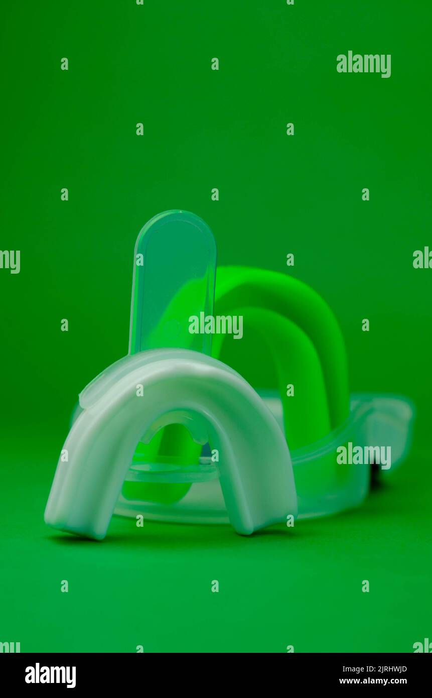 two rubber boxing mouth guards, white and green, protection for lips ...