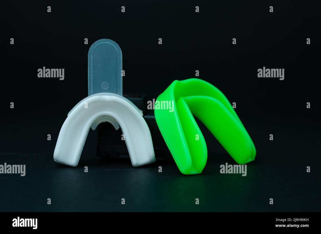 two rubber boxing mouth guards, white and green, protection for lips ...