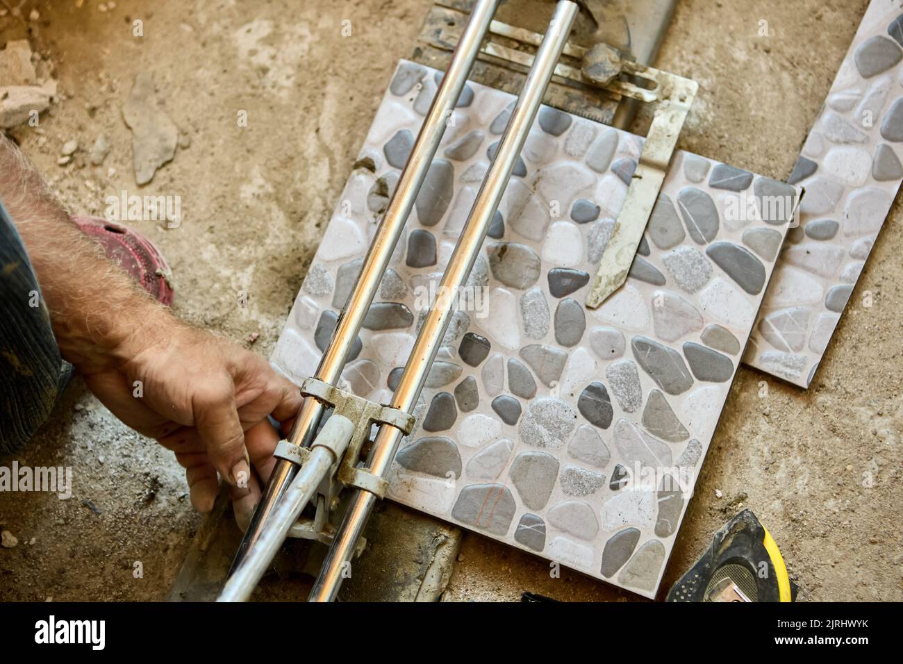 Tile cutter is used by tiler for interior construction work Stock Photo ...