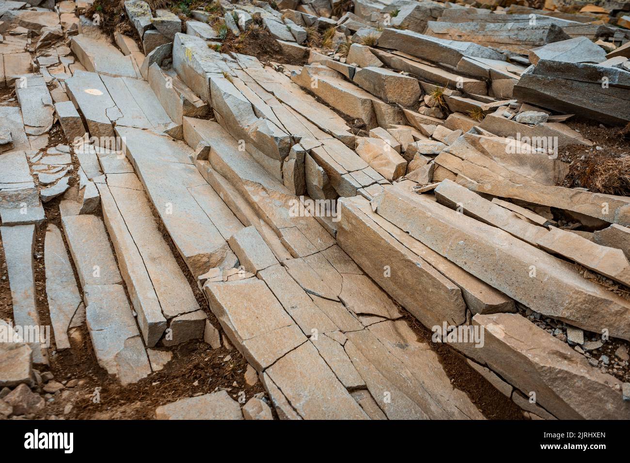 Old broken stones on the ground Stock Photo - Alamy