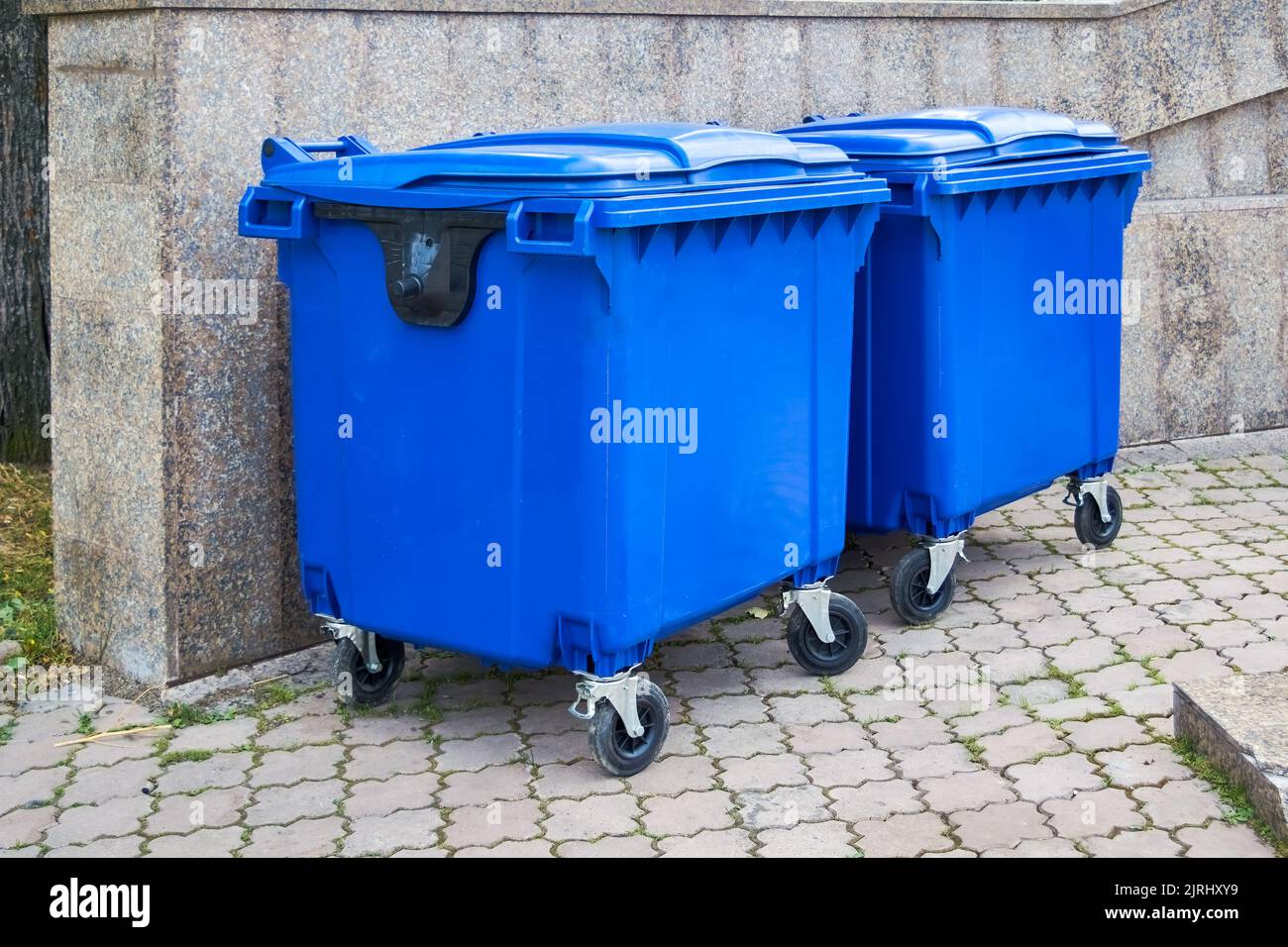 Blue plastic trash recycling containers. Blue containers for collecting ...