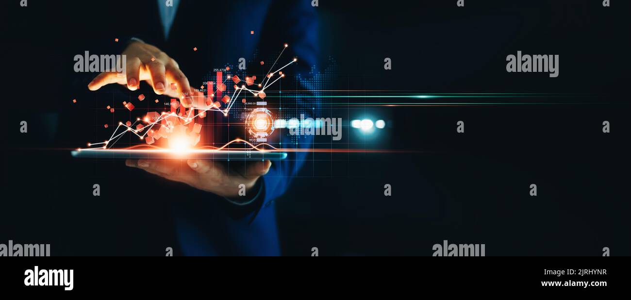 Businessman using tablet analyzing sales data and economic growth graph ...