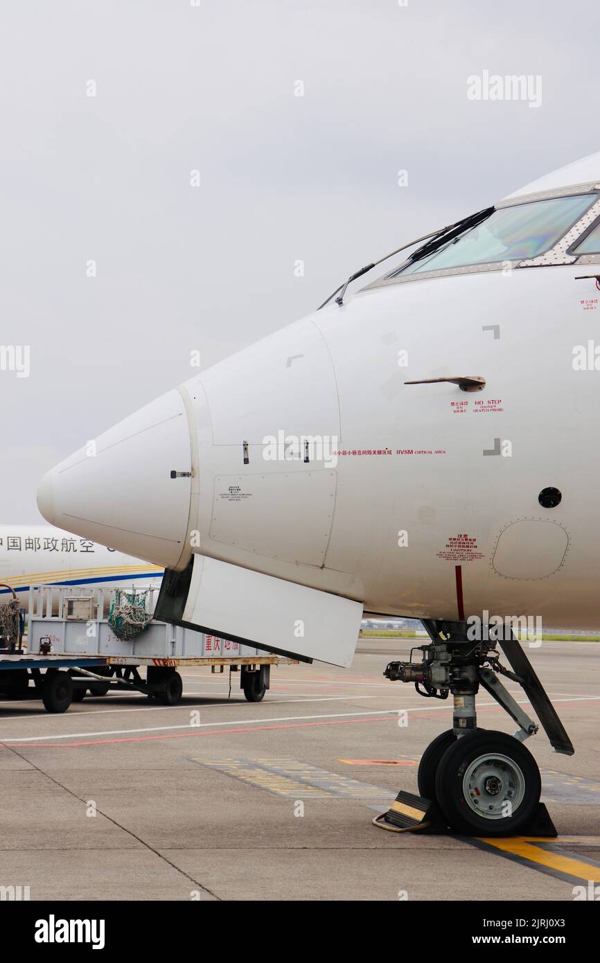 A vertical shot of an airplane in the airport getting ready for a take ...