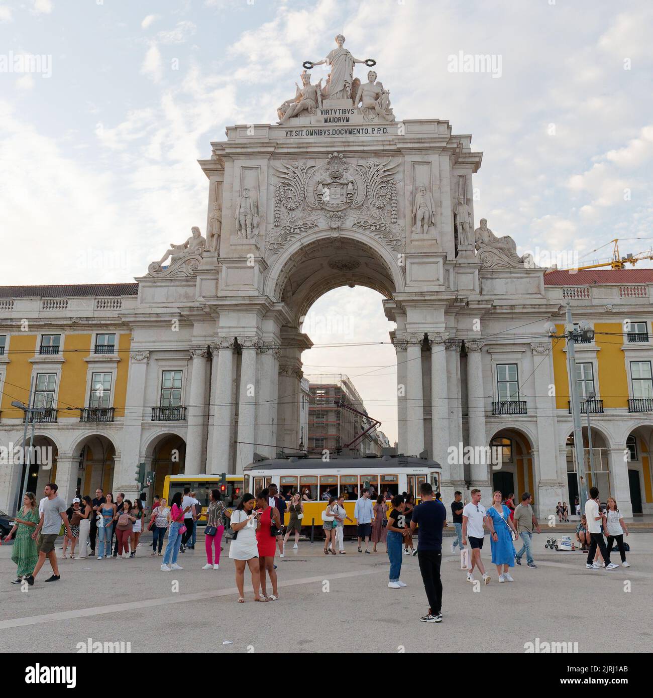 Commercial Square and the Rua Augusta Arch in Lisbon, Portugal. Tram ...