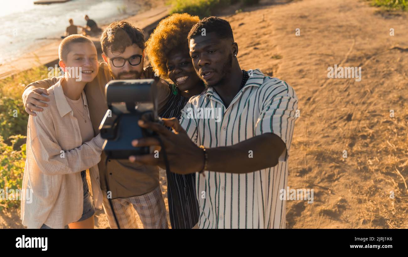 Multi-ethnic group of best friends creating memories by taking funny ...