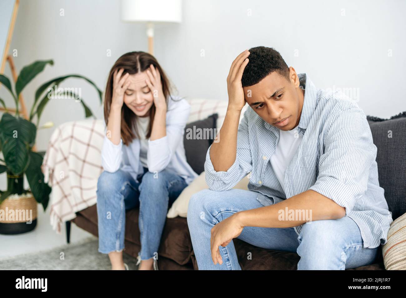 Quarrel, resentment against each other. Annoyed sad spouses, a ...