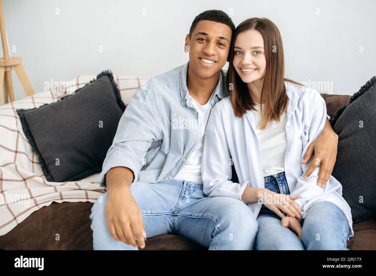 Happy together. Portrait of married young couple. Positive multiracial ...