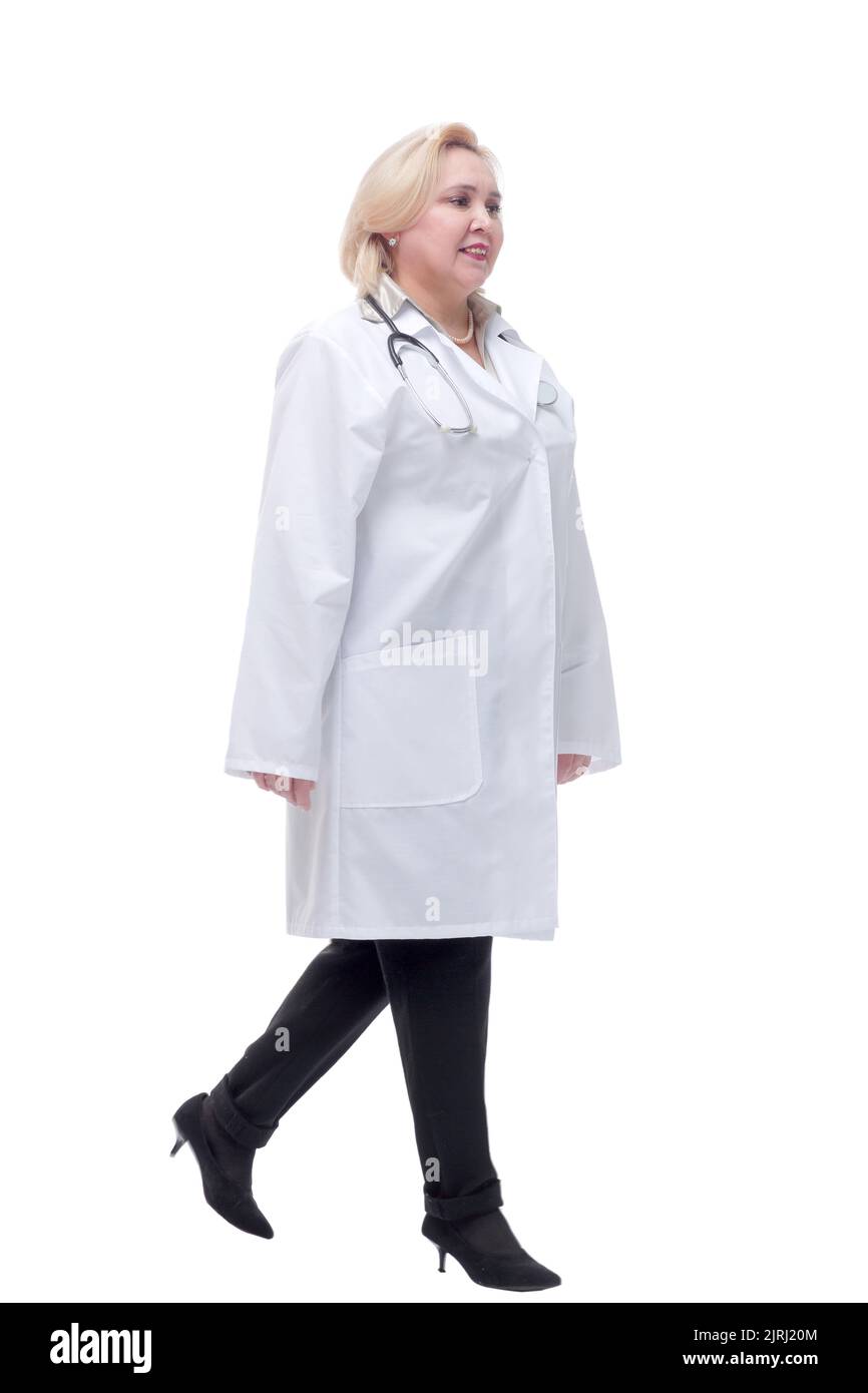 Female doctor walking towards the camera smiling Stock Photo - Alamy