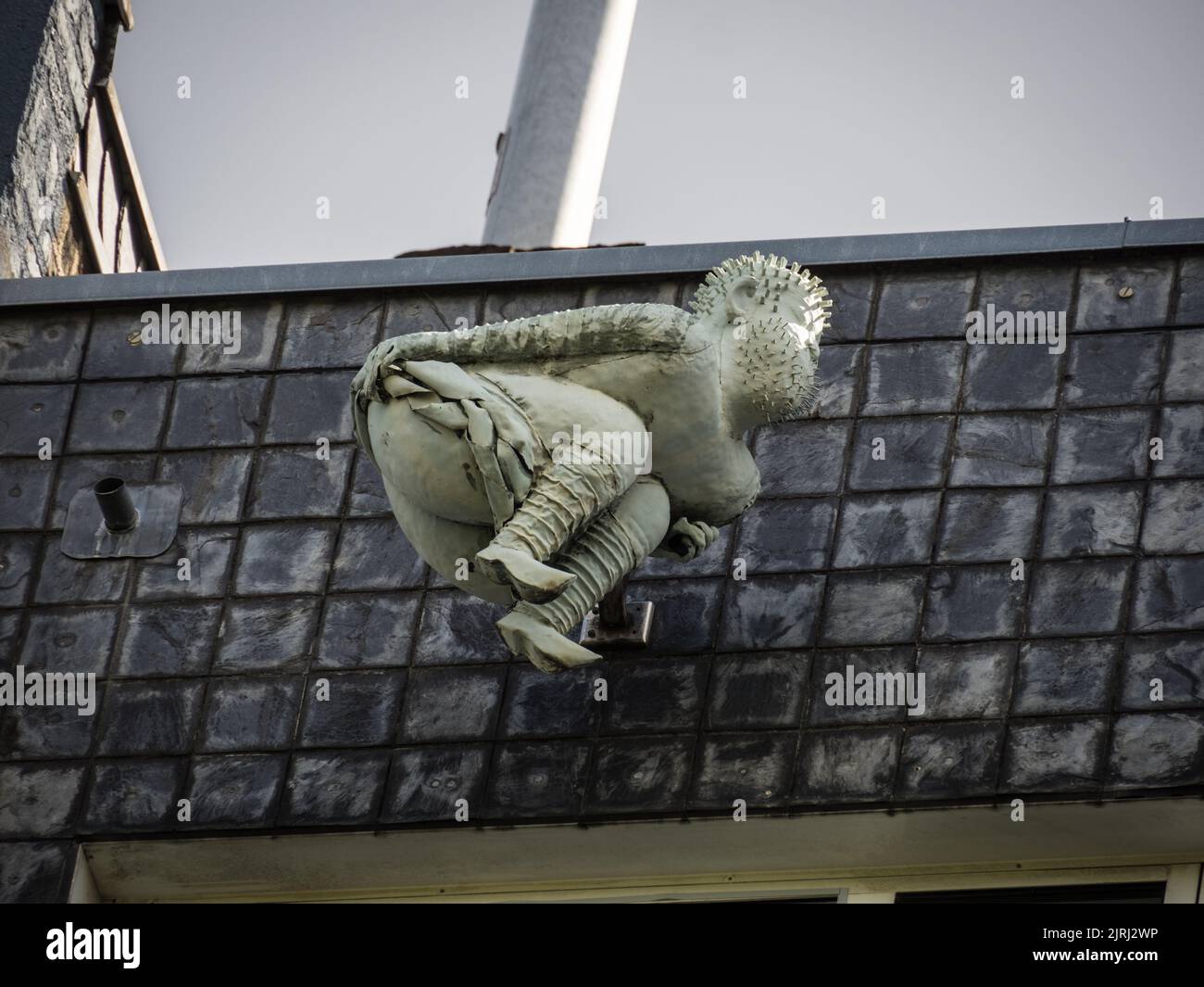 Statue of a person showing his bottom in Cologne, Germany Stock Photo ...