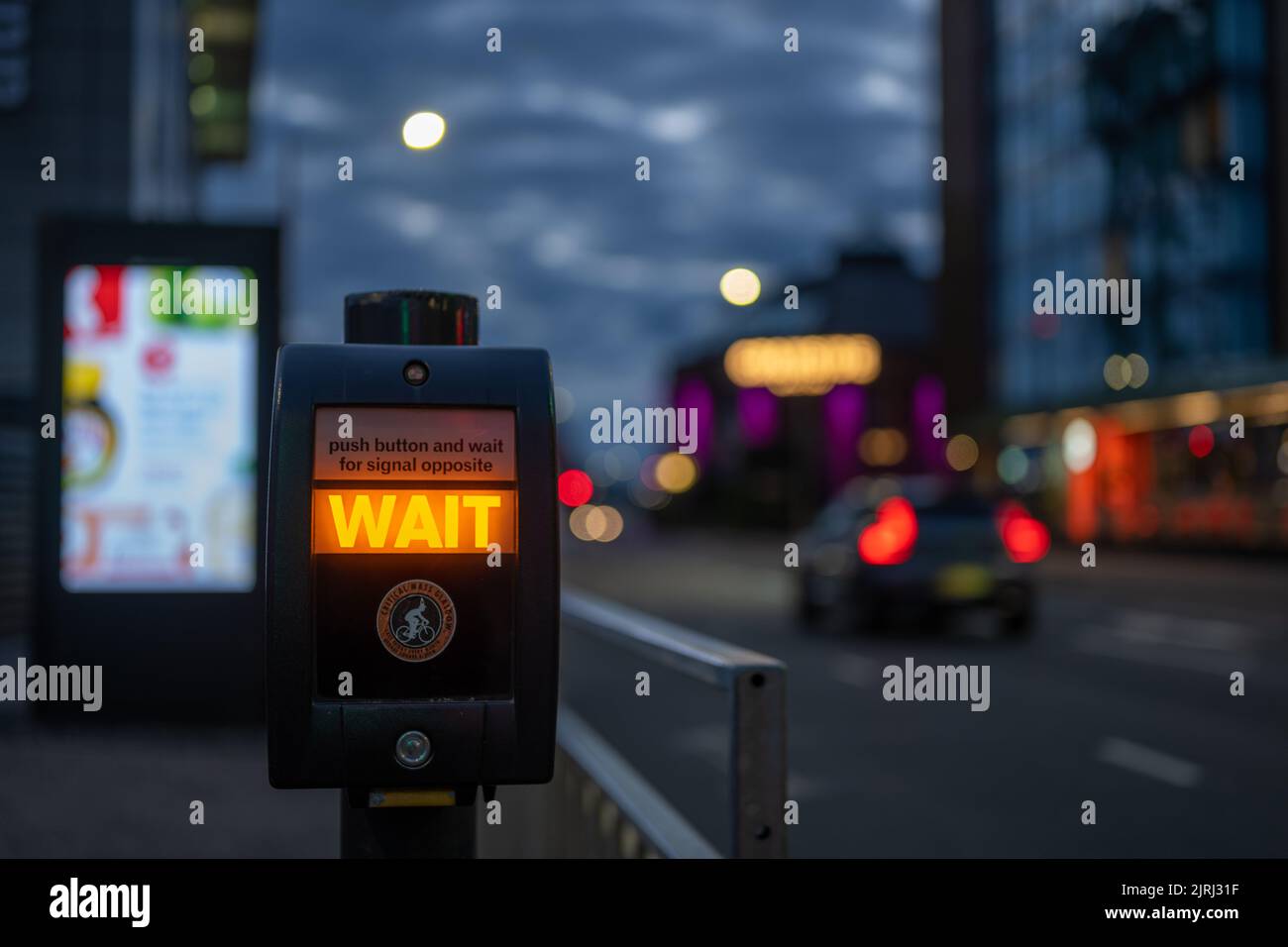 Pedestrian crossing WAIT button in Glasgow 2021 Stock Photo - Alamy