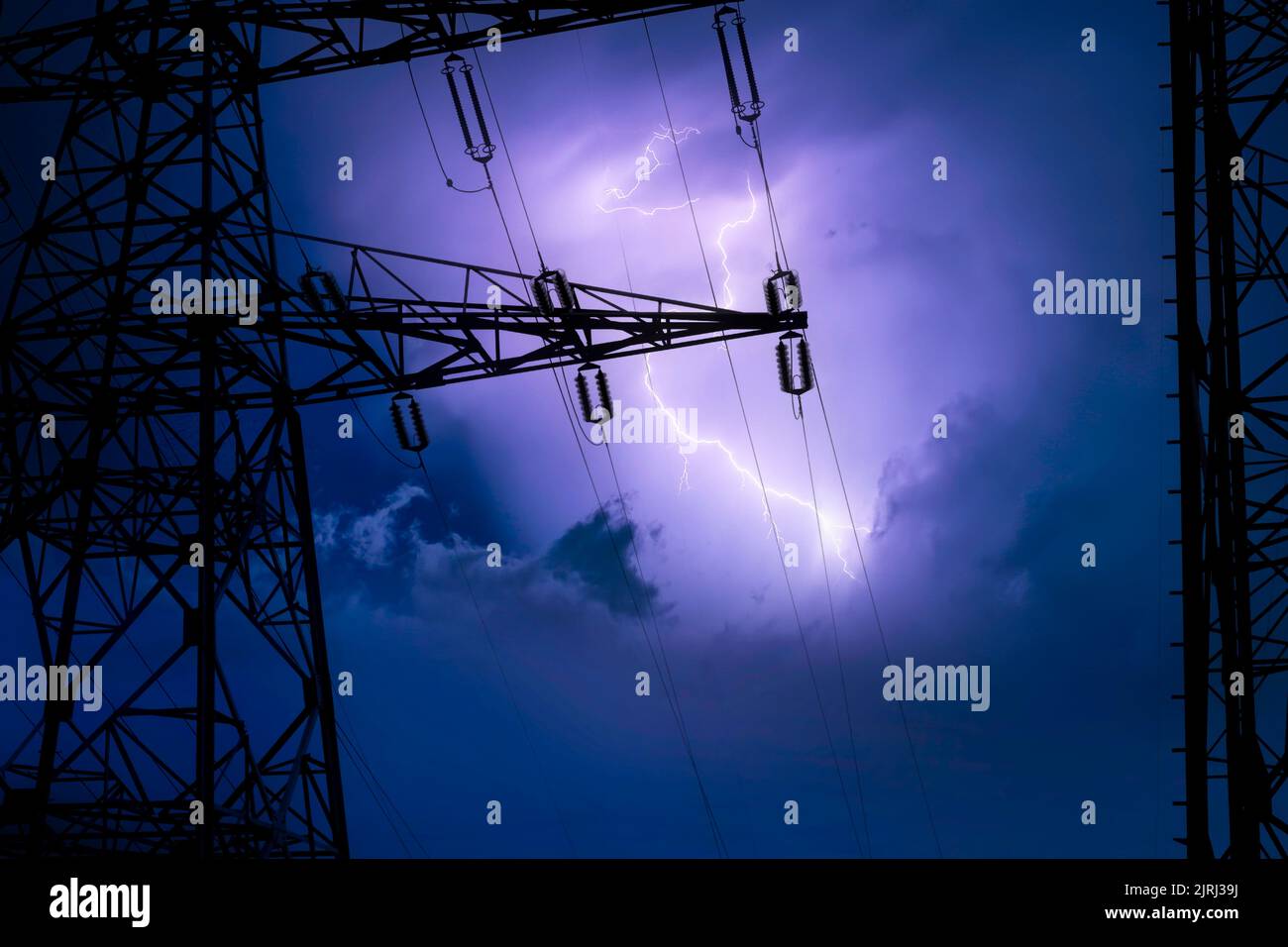 A high voltage transmission tower in a lightning storm Stock Photo - Alamy