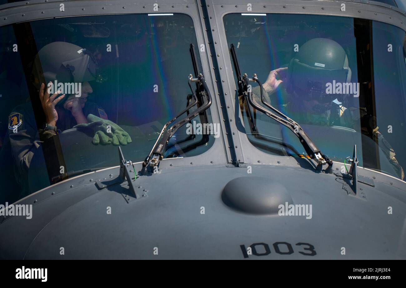 Lt. Col. Mary Clark and David Arrington, 96th Test Wing pilots, adjust ...