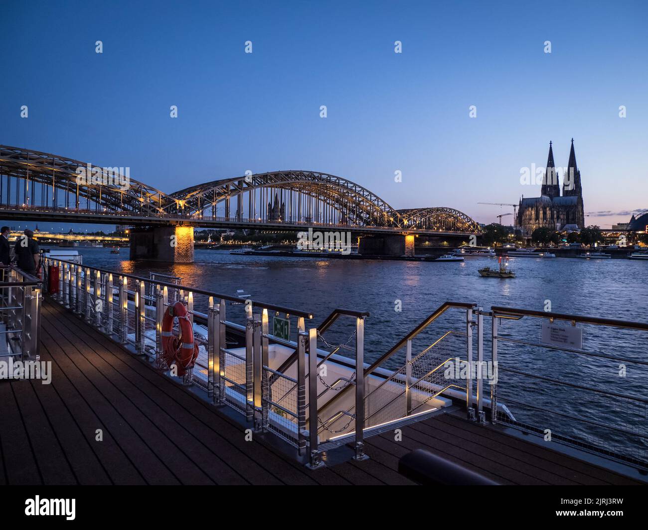 Evening view across the RHine of the Hohenzollern Bridge and Cathedral ...