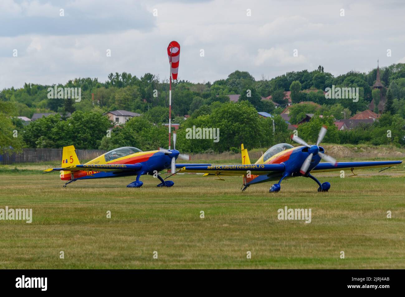 Two colorful airplanes at Hangariada aeronautical festival show ...