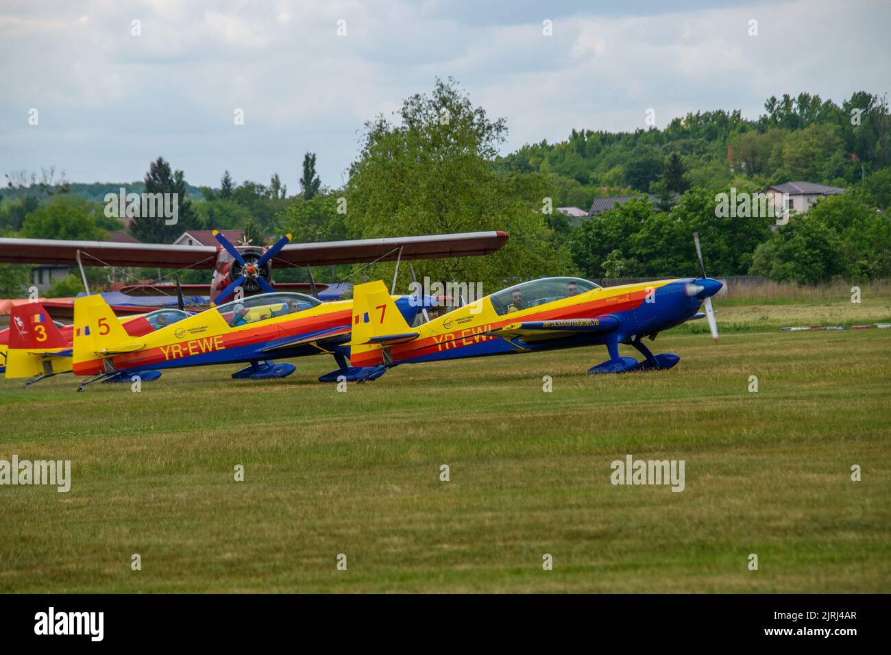 Two colorful airplanes at Hangariada aeronautical festival show ...