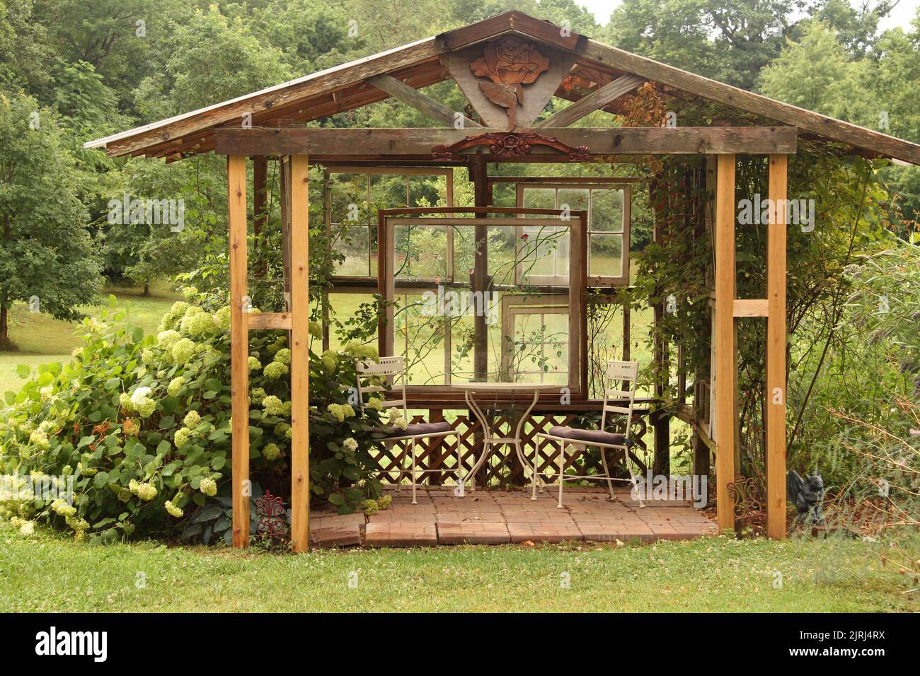 Relaxing, rustic outdoor seating area in a garden. Wooden gazebo Stock ...