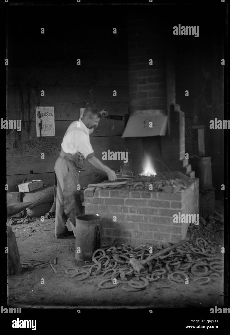 Blacksmith at Work, circa 1910, by Fred Brockett Stock Photo - Alamy
