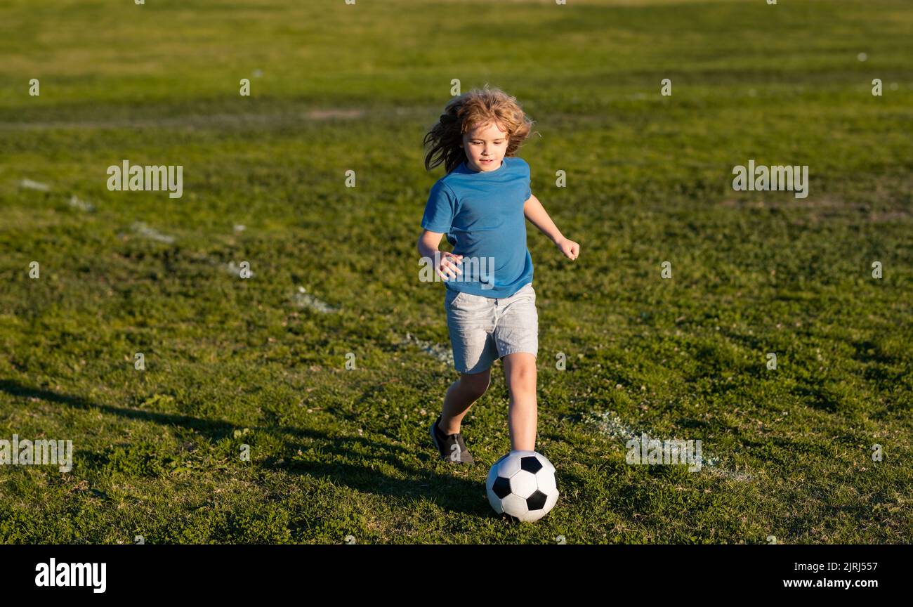 Soccer kid boy playing football. Child boy play football on outdoor ...