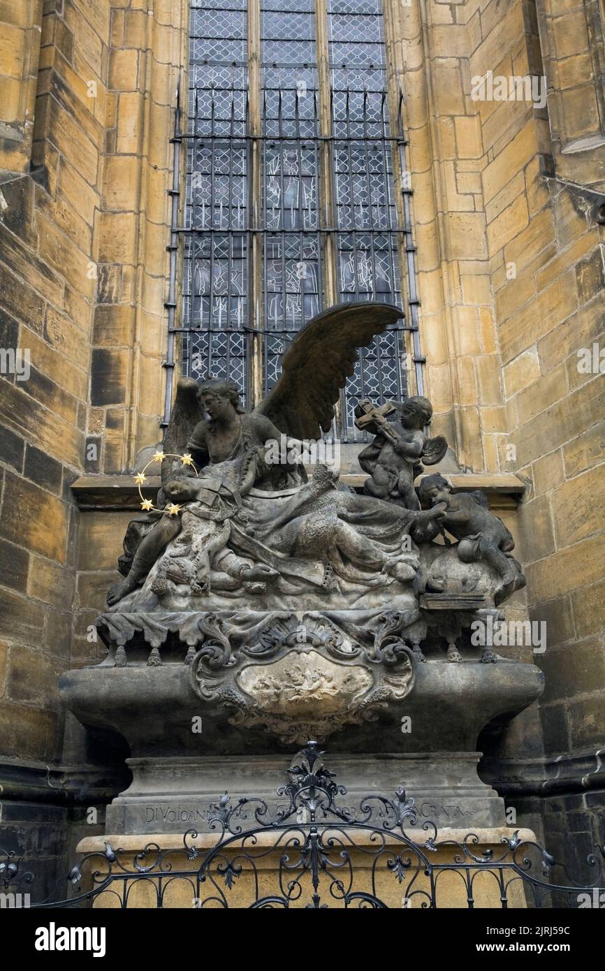 Statue on an exterior wall of the 14th century gothic style Saint-Vitus ...