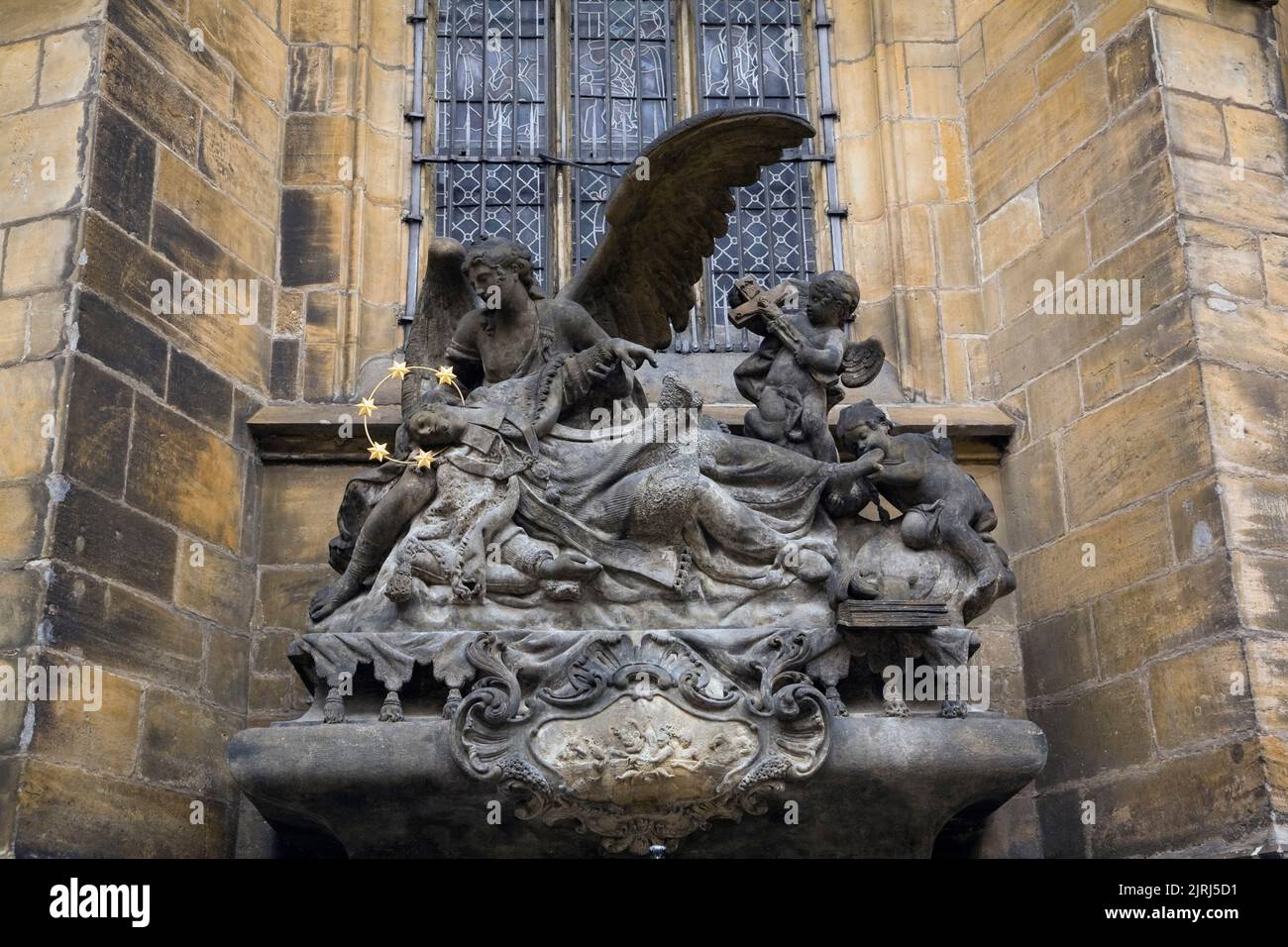 Statue on an exterior wall of the 14th century gothic style Saint-Vitus ...