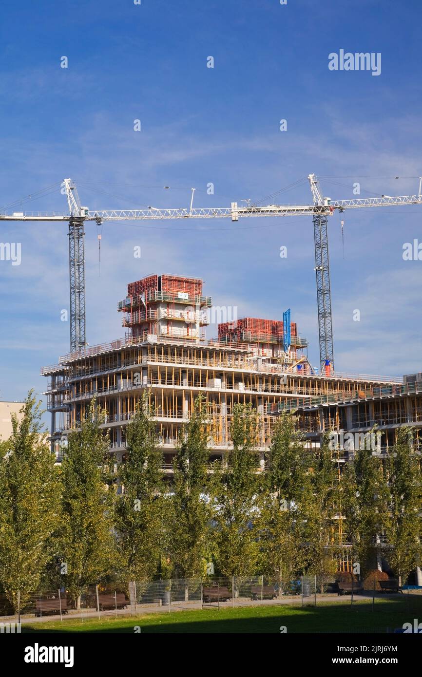 Construction work cranes over unfinished CHUM hospital building ...