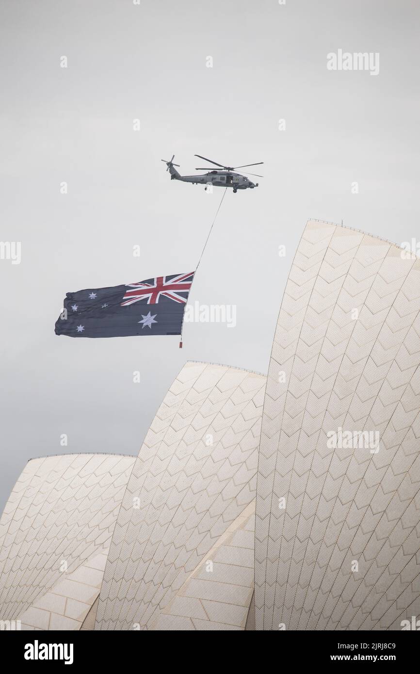 A closeup shot of a helicopter flying the Australian Flag over the ...