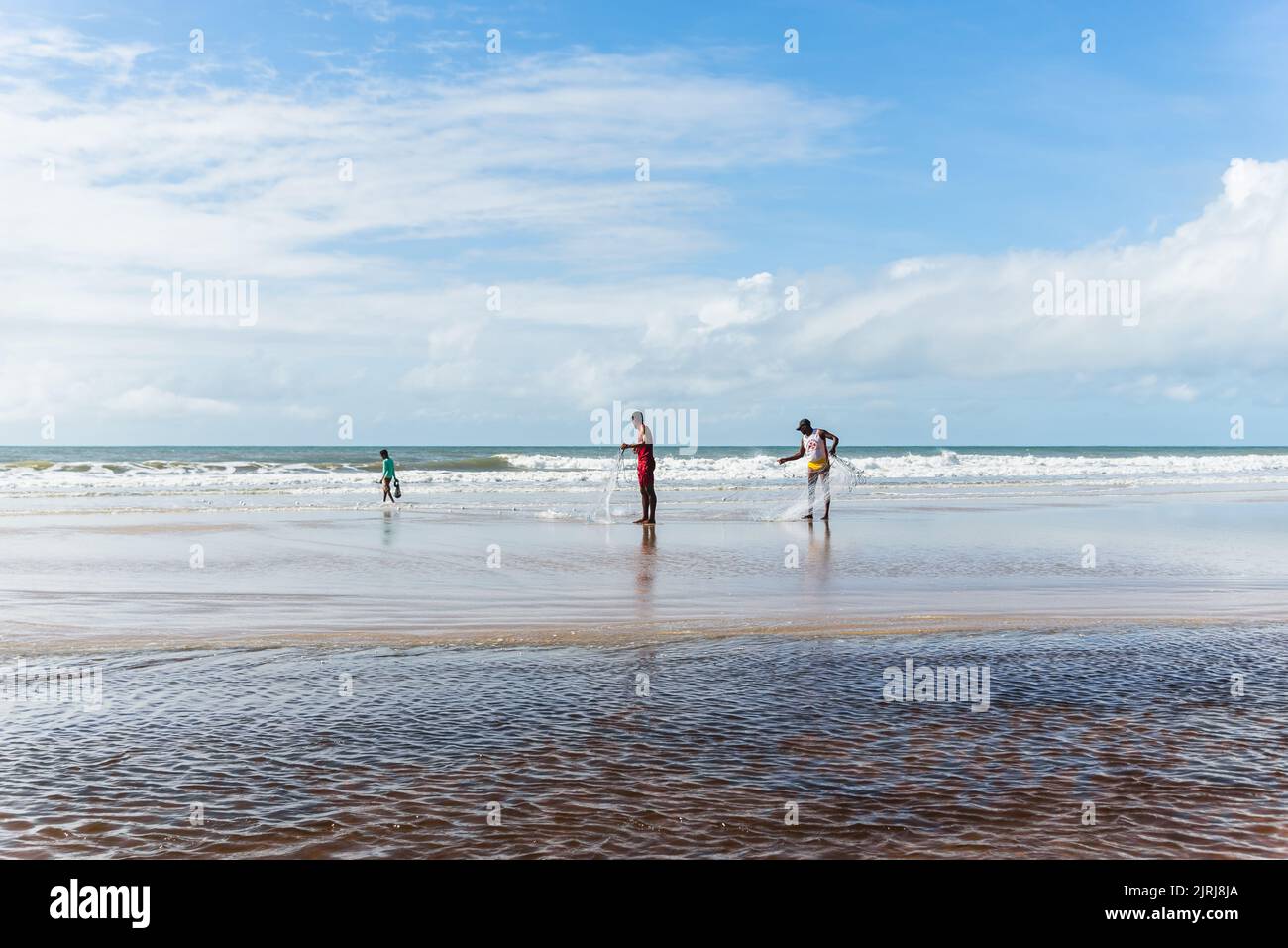 Reddish water of a river against the blue sky. Guaibim beach, coast of ...