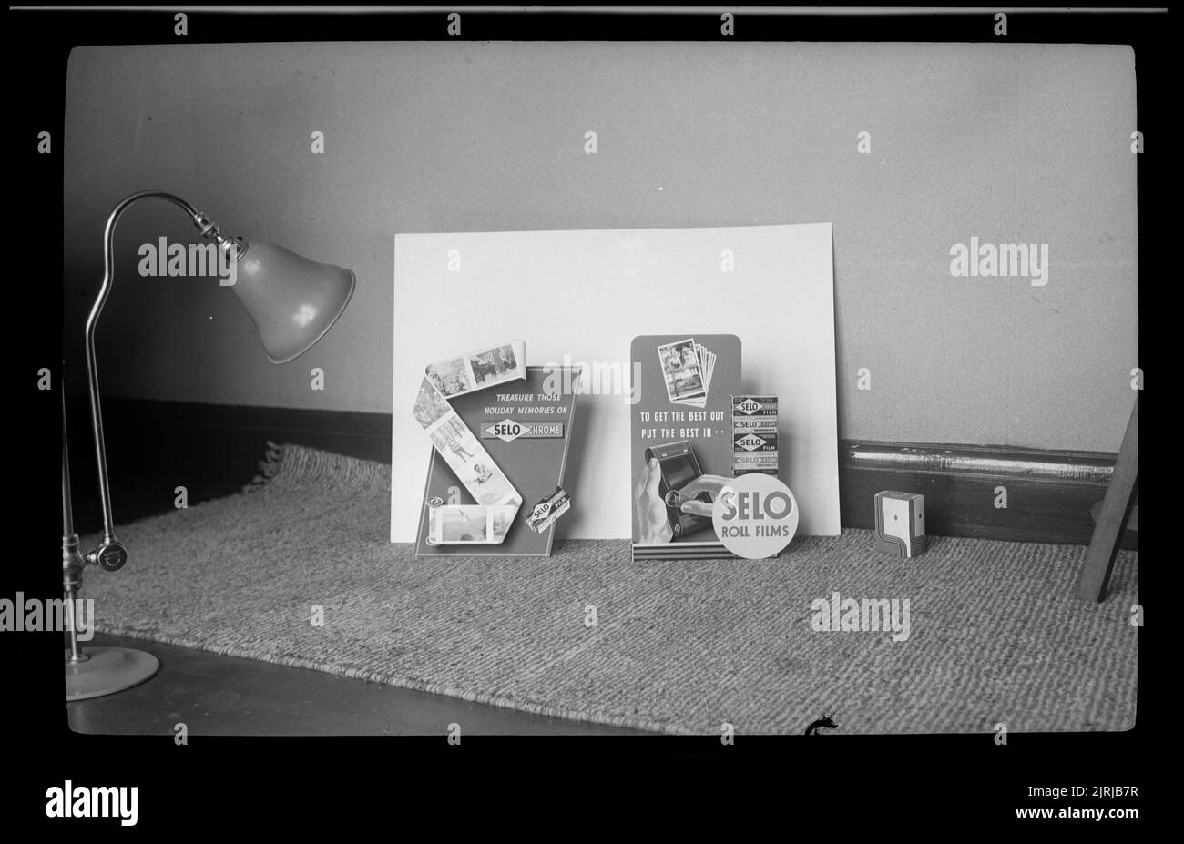 Wide view of two Selo film advertising posters leaning against white ...