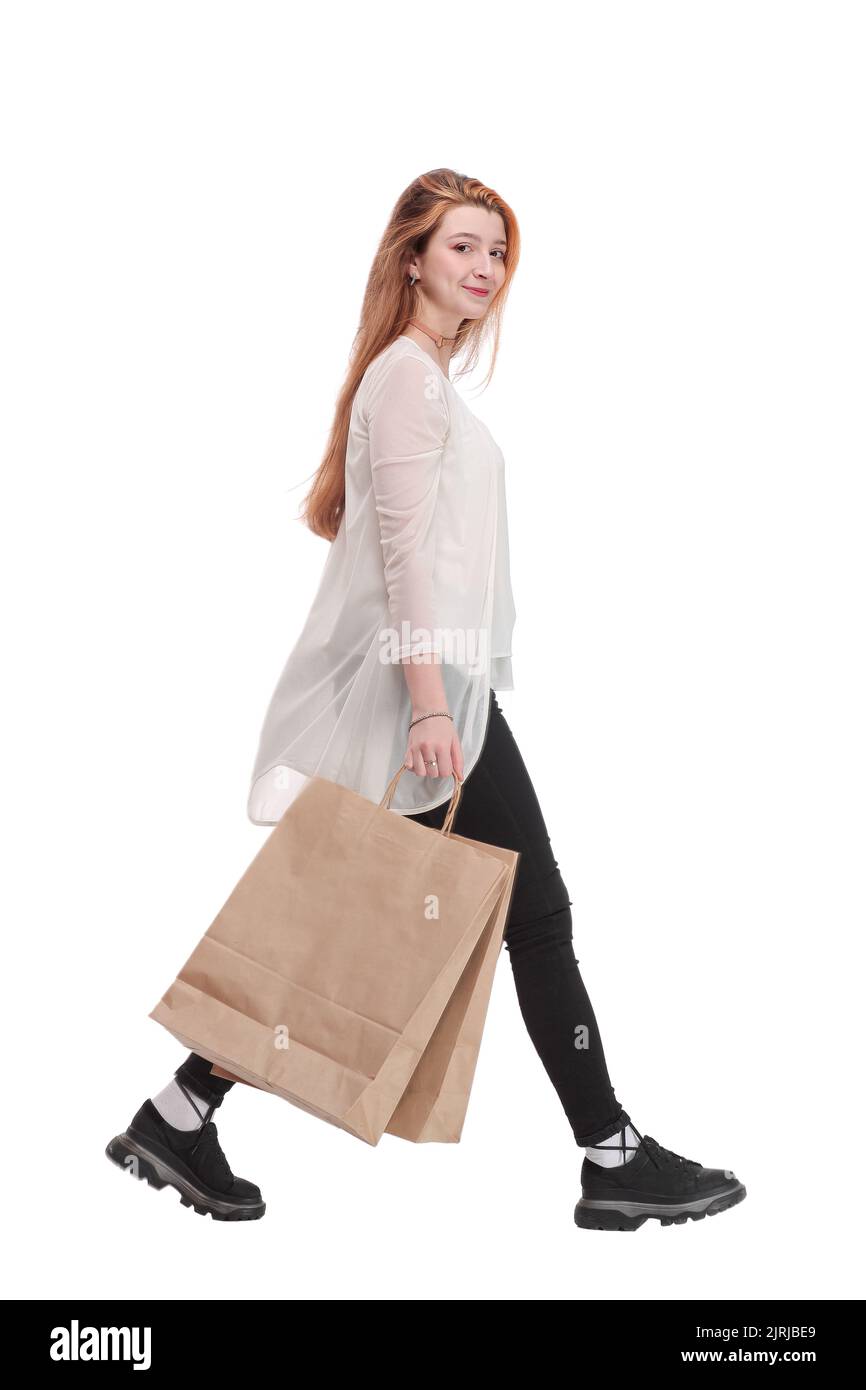 Side view of going beautiful girl with shopping bags Stock Photo - Alamy