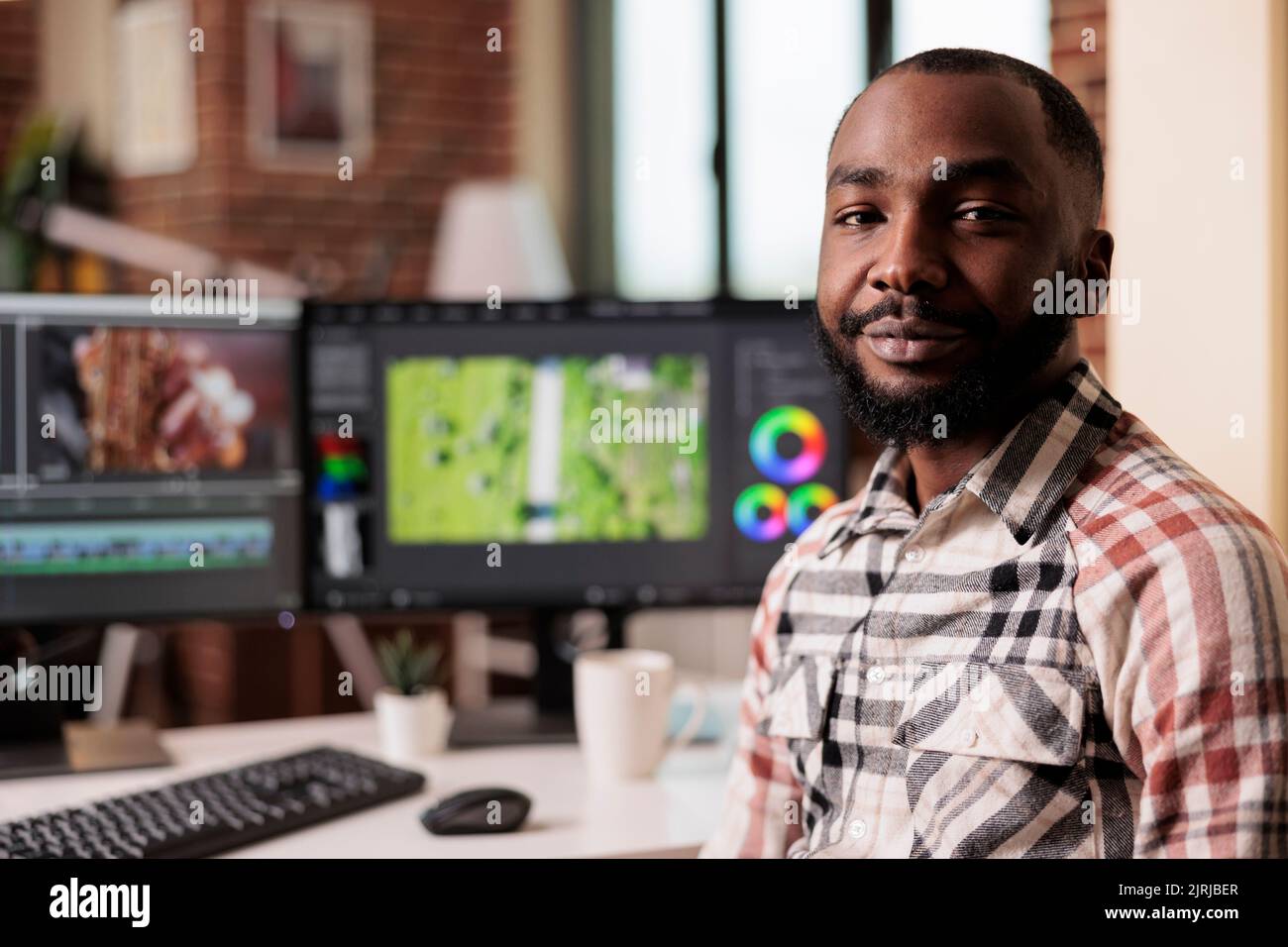 Portrait of freelancer working on video editing software to make film ...
