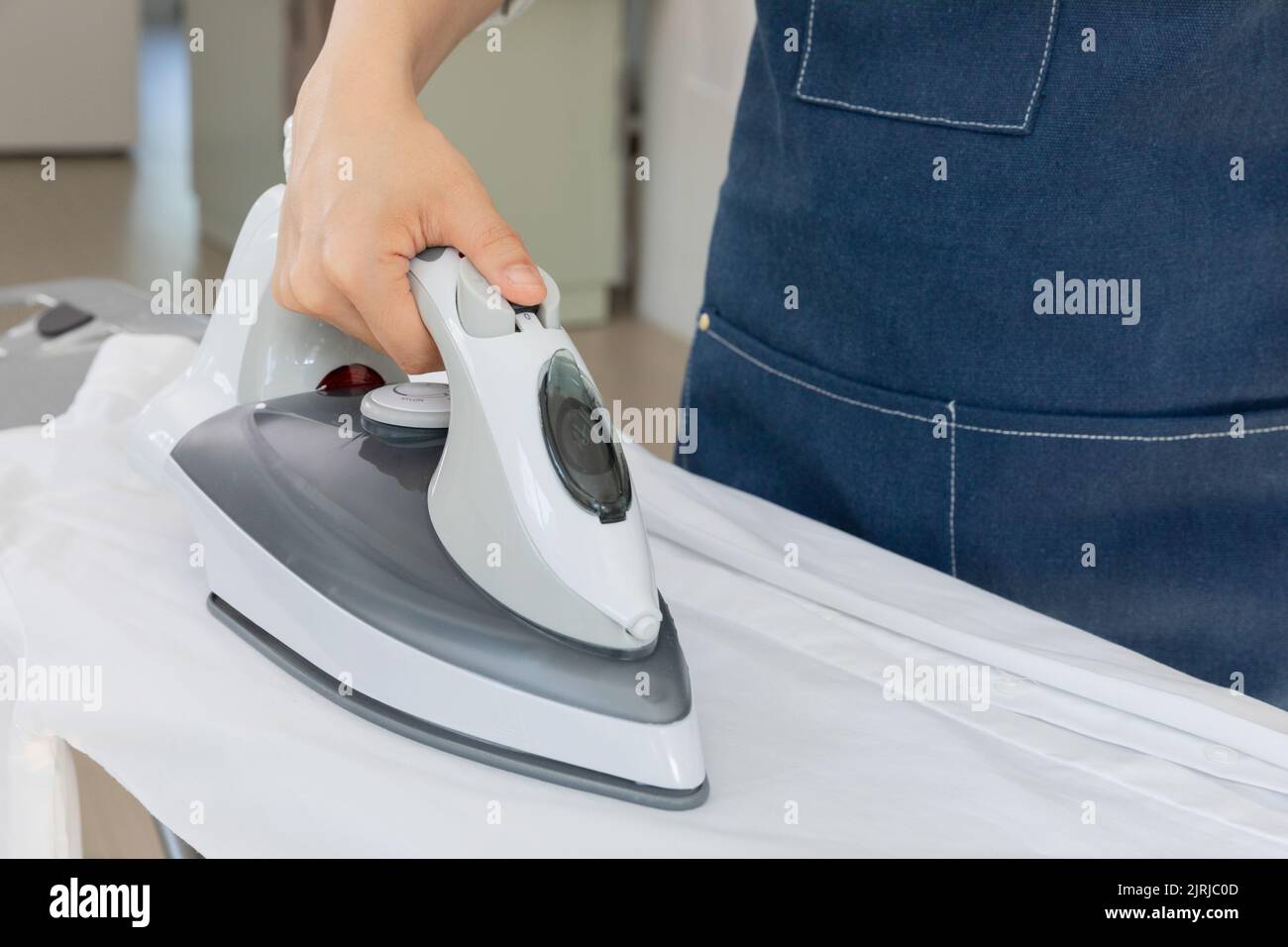 aesthetic laundry concept ironing shirts Stock Photo - Alamy