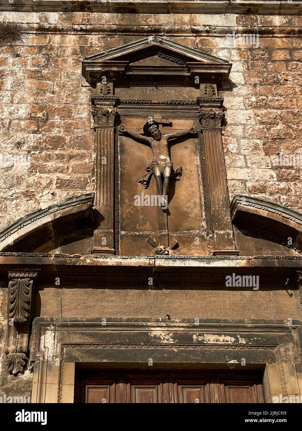 Christ crucified, sculpture on the facade of Chiesa di San Leone Magno ...