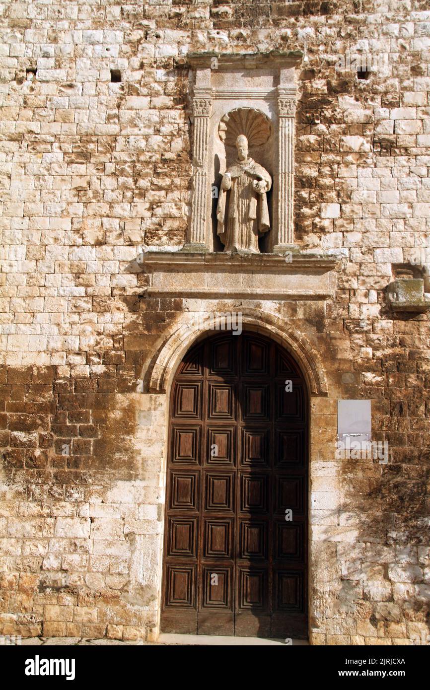 Statue of the patron saint on the exterior of Chiesa di San Leone Magno ...