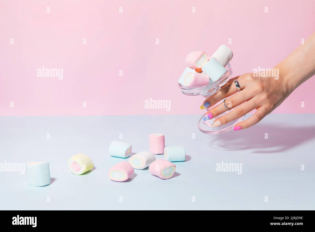 beauty hands motion series holding marshmallow Stock Photo - Alamy