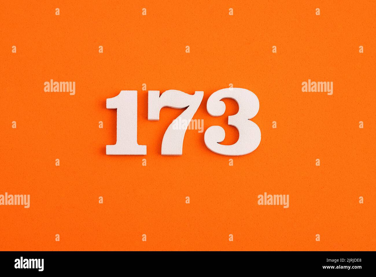 Number 173 - On orange foam rubber background Stock Photo - Alamy